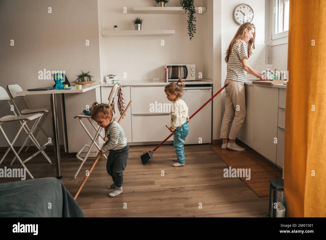 Child sweeping floor hi-res stock photography and images - Alamy