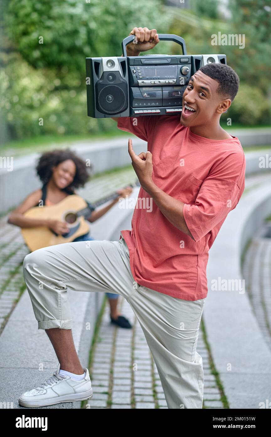 Girl standing with guitar hi-res stock photography and images - Alamy