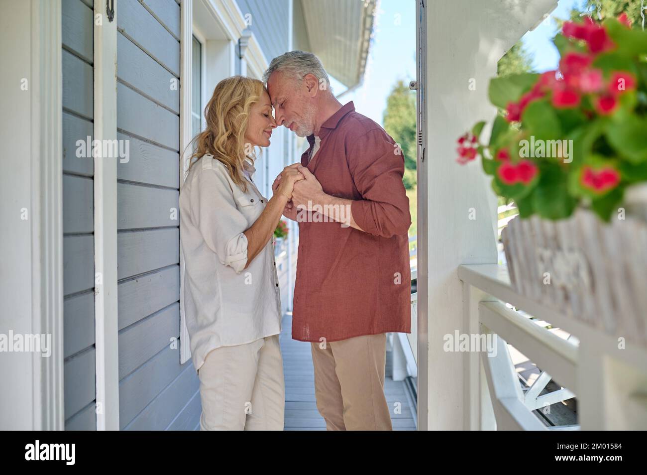 In love. Mature couple feeling good and in romantic mood Stock Photo ...