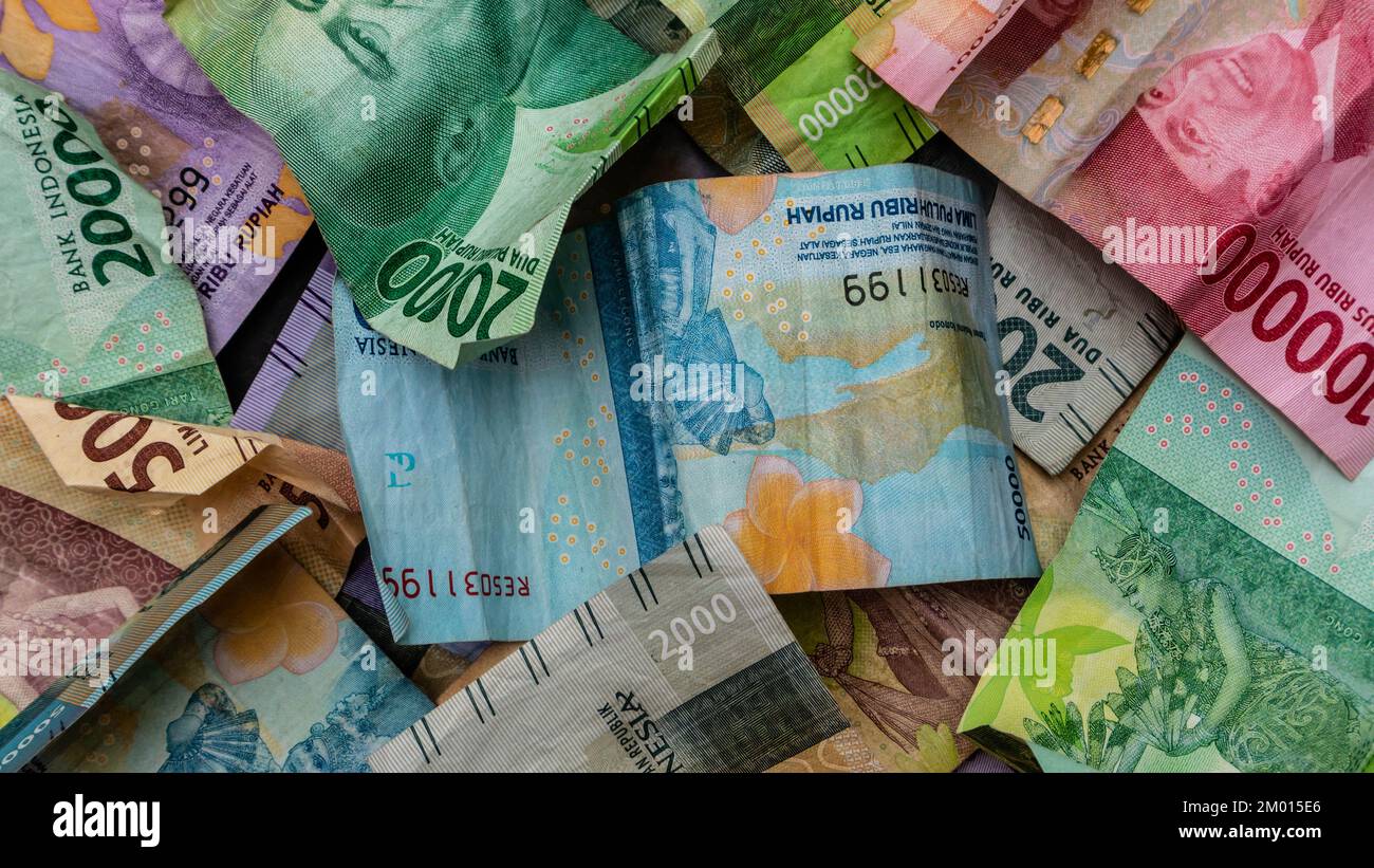 pile of rupiah banknotes as background Stock Photo - Alamy