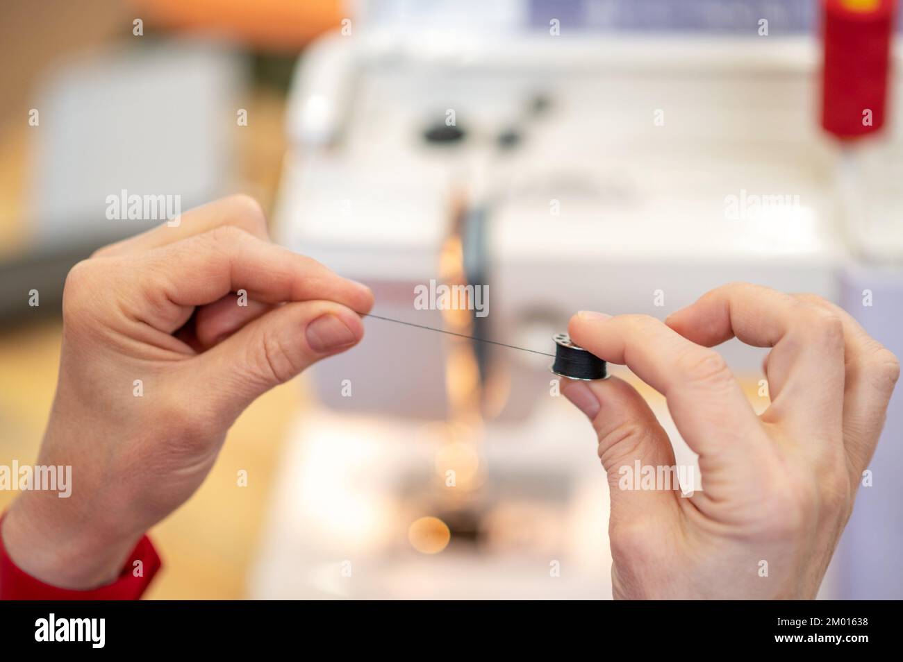 Person hand sewing hi-res stock photography and images - Alamy