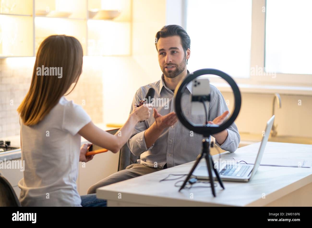 Female journalist microphone hi-res stock photography and images - Alamy