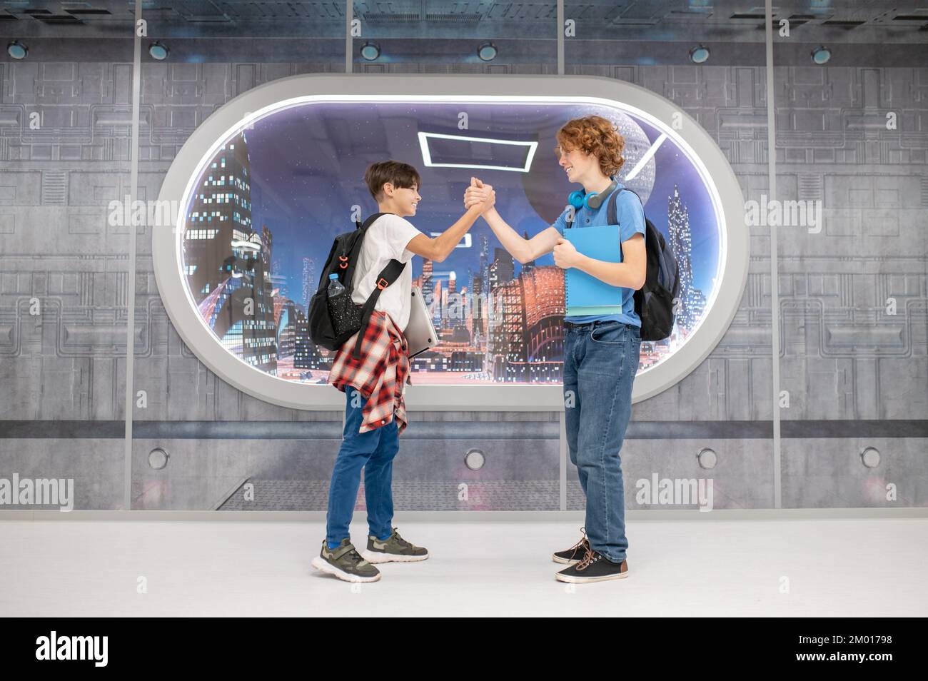 Two boys looking at computer hi-res stock photography and images - Alamy