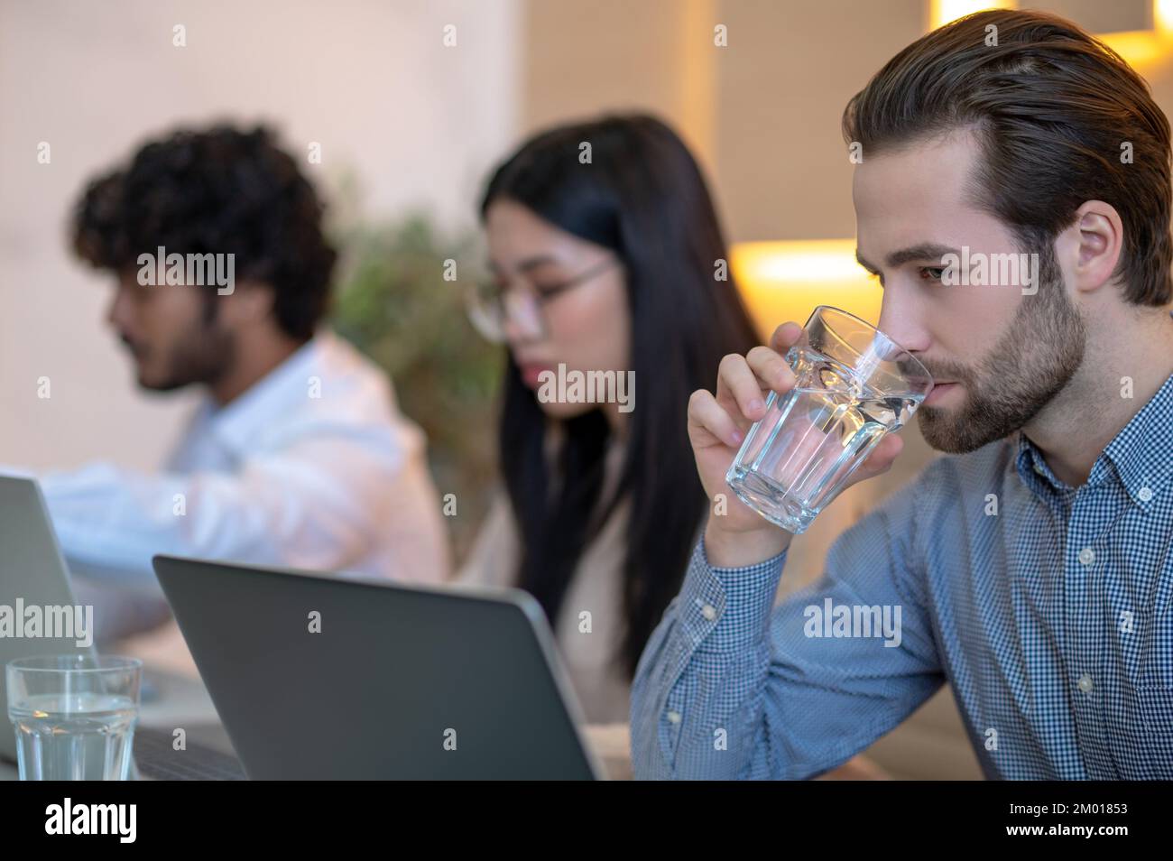 Woman seated beside table hi-res stock photography and images - Alamy