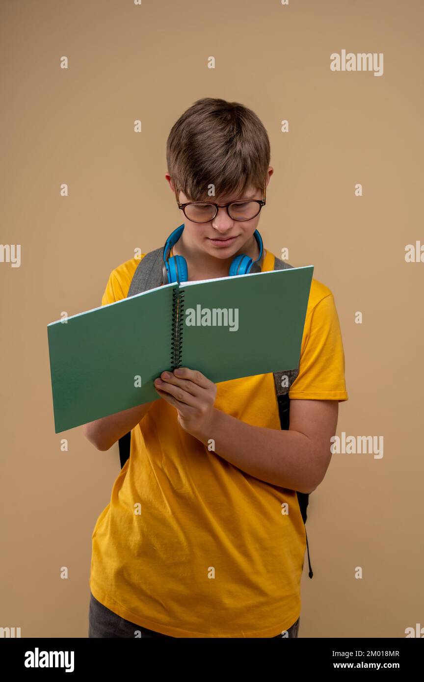 Boy writing notes hi-res stock photography and images - Alamy