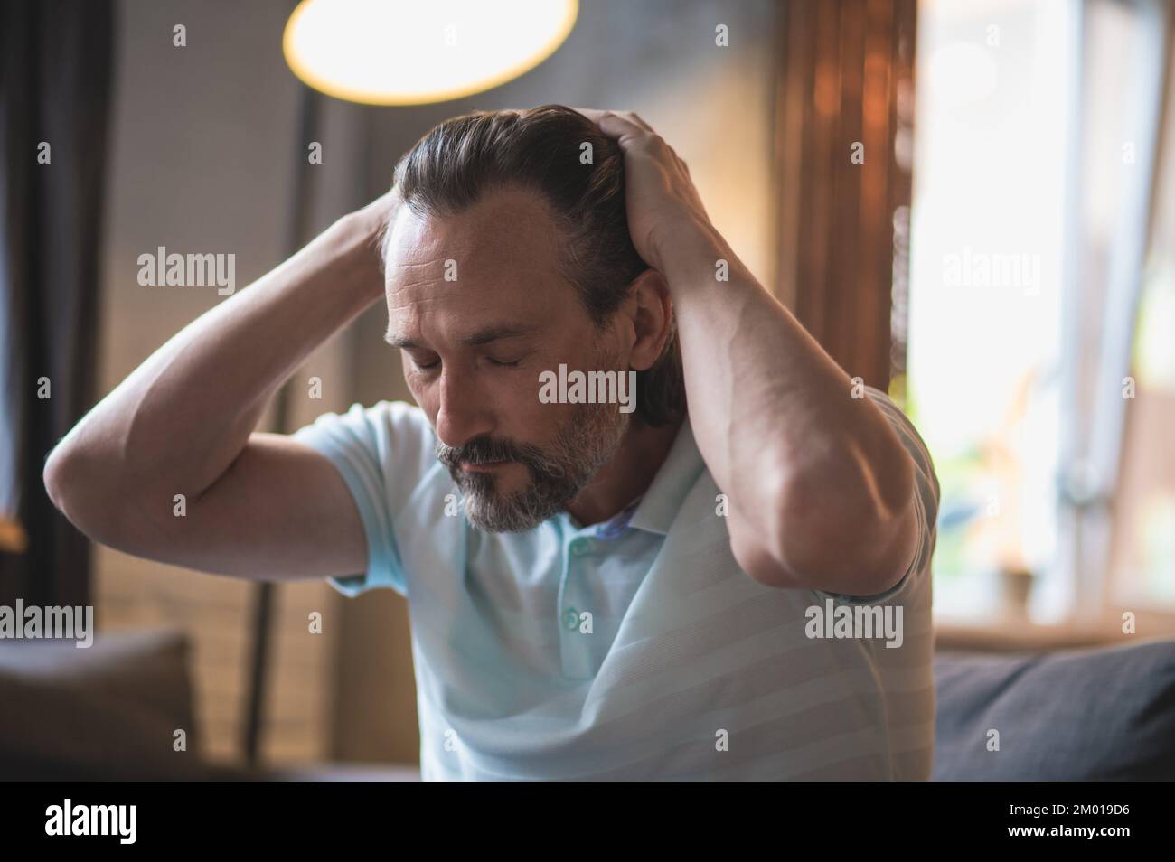 Man in thoughts. A portrait picture of a man feeling stressed and ...