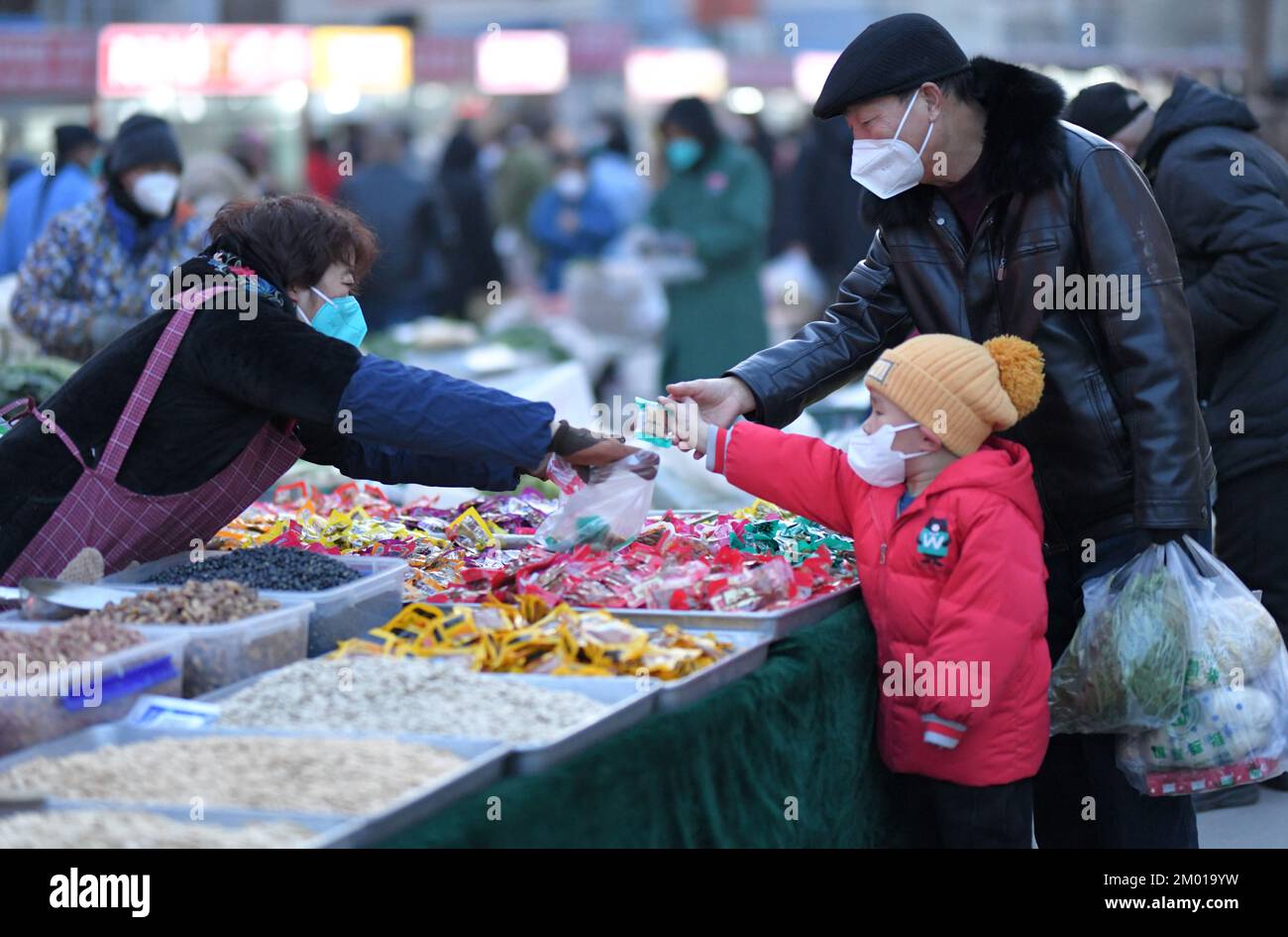 BAZHOU, CHINA - DECEMBER 3, 2022 - People shop at a market in Bazhou ...