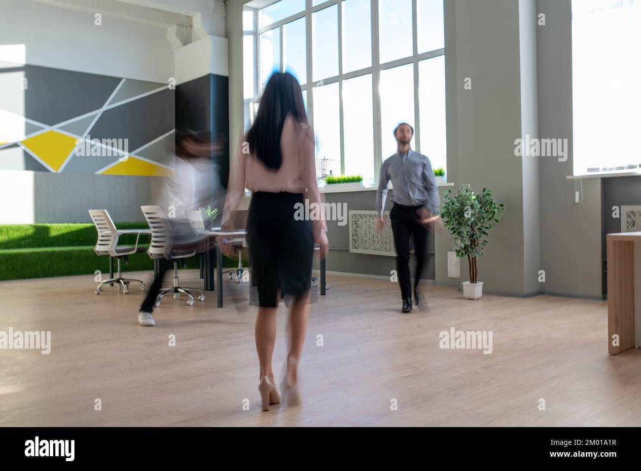 Woman office walking inside hi-res stock photography and images - Alamy