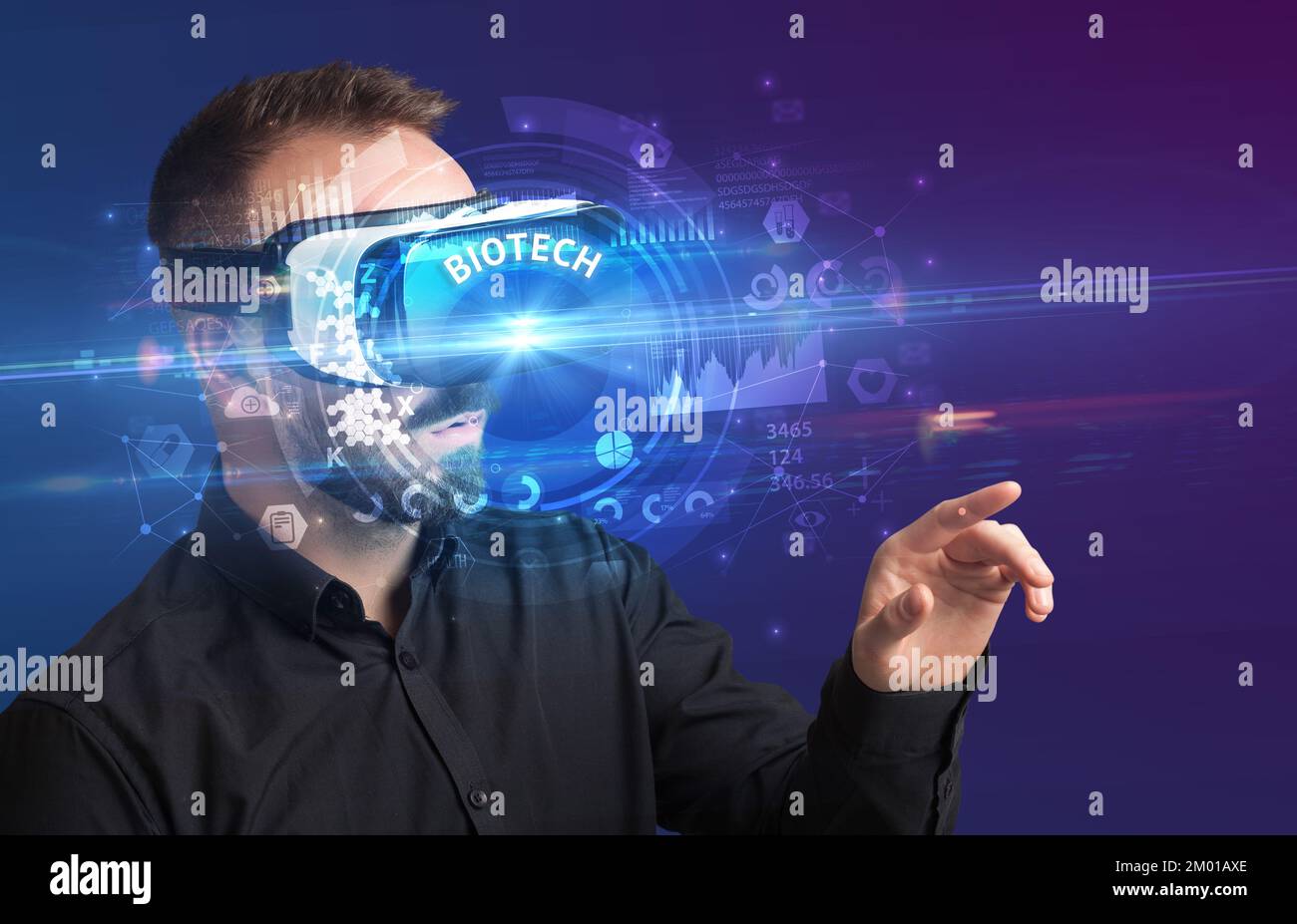 Businessman looking through VR glasses Stock Photo - Alamy