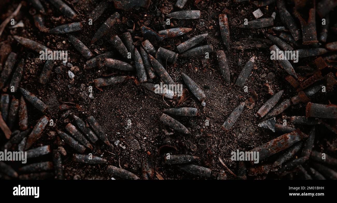 Burnt ammunition, bullets and casings after the fire. Burned arsenal of ...