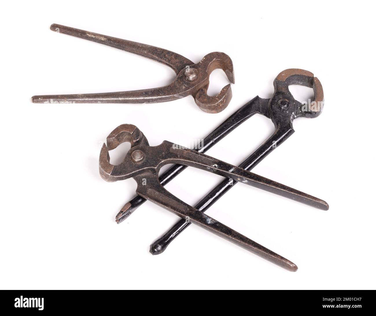 Three old and rusty pairs of pincers isolated on white background Stock ...