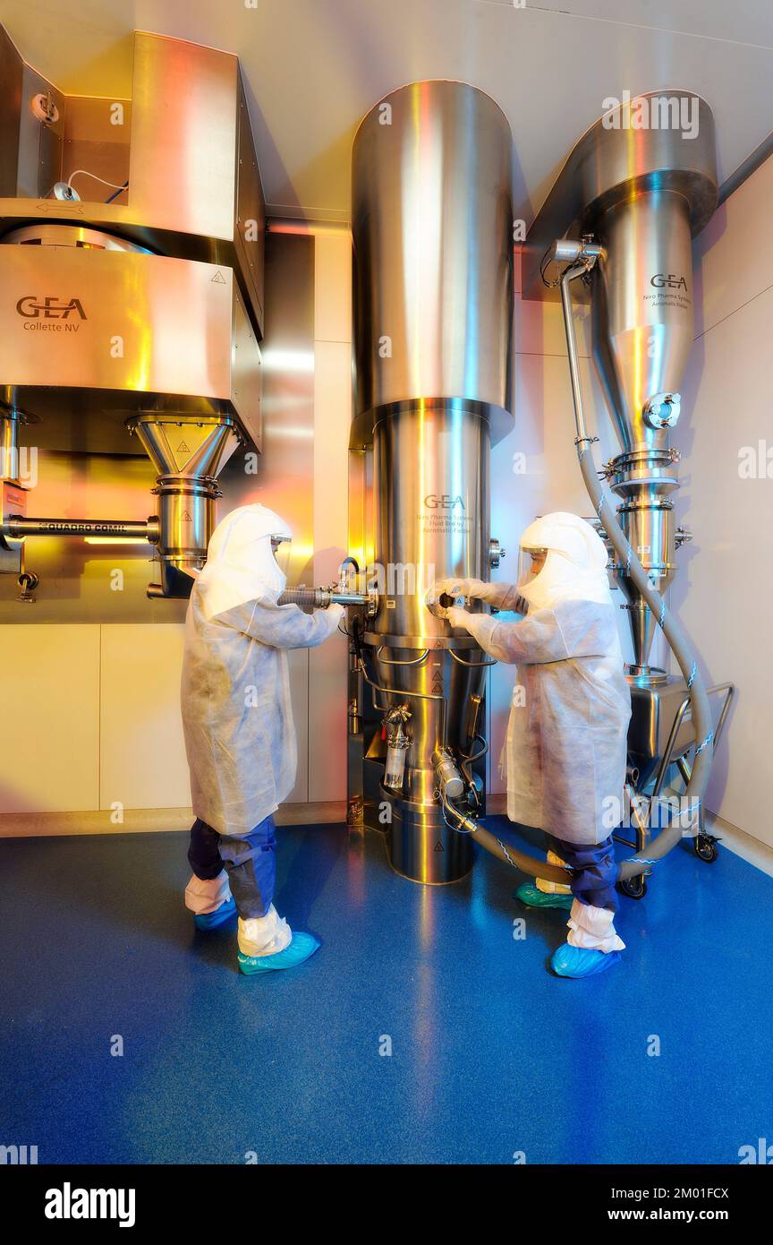 Laboratory technicians equipped with Security Suit inside a technology ...