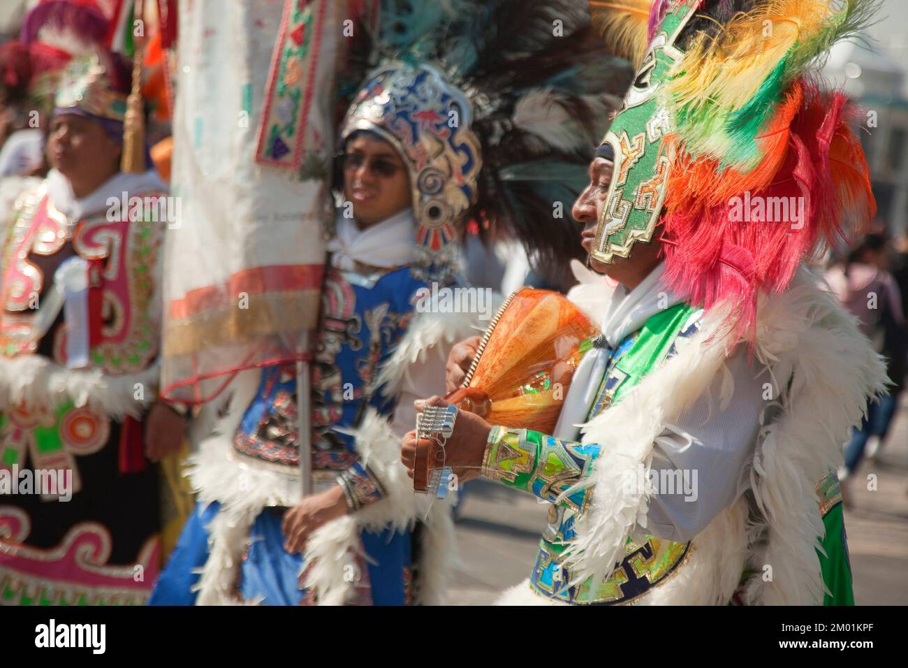 Indigenous people wearing mask and traditional clothing performing ...