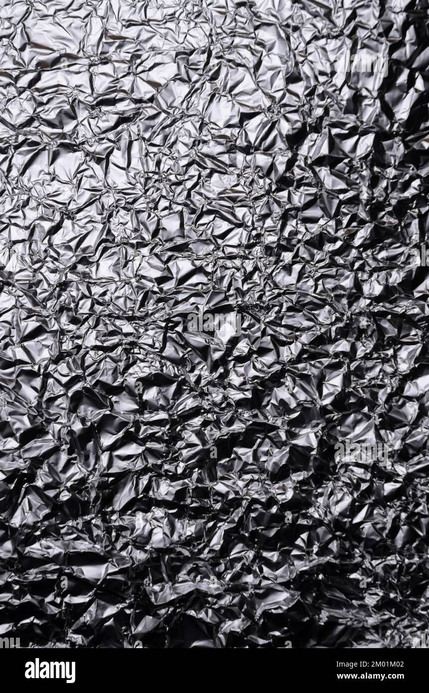 Silver metallic crumpled aluminum foil background Stock Photo - Alamy