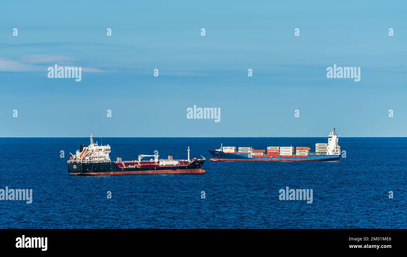 Oil Tanker and Container Ship at sea with Barcelona in the background ...