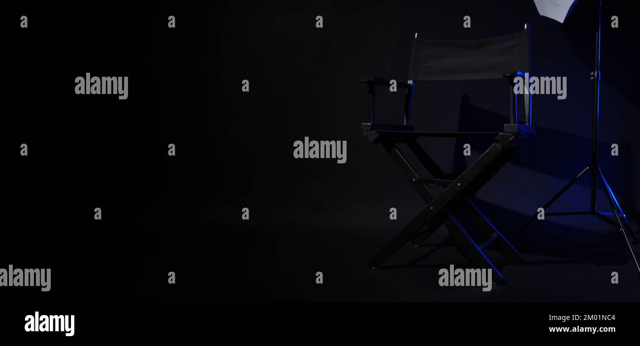 Director chair with cinema lightbox sign Director text on it and ...