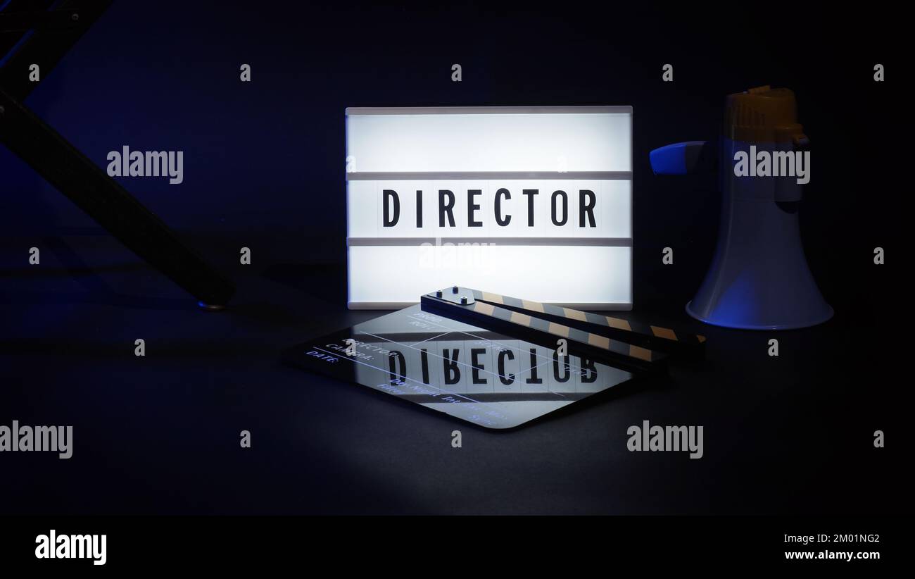 Director chair with cinema lightbox sign Director text on it and ...