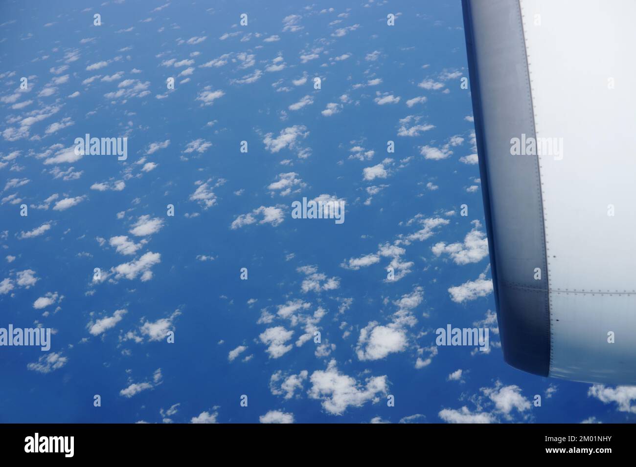 aerial view of blue sky with clouds from jet flight. Focus on clouds ...