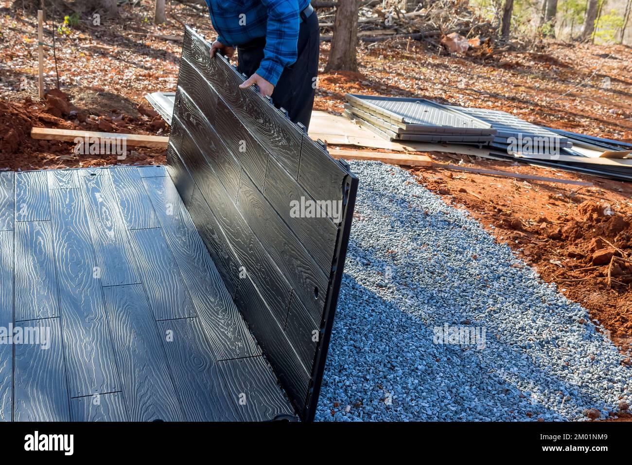 Putting together plastic shed for backyard that will be used for ...