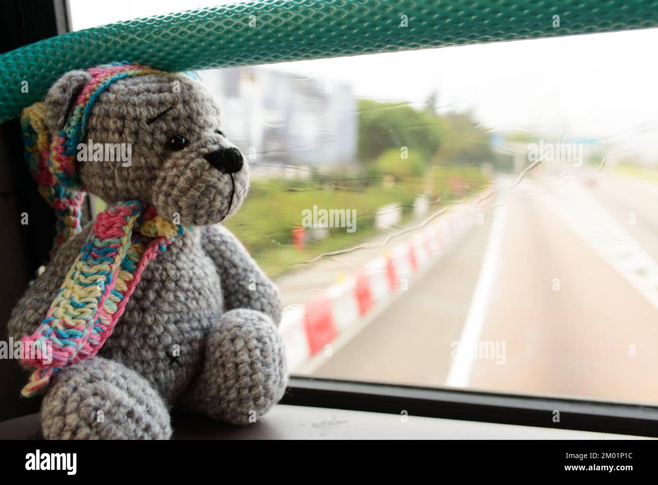 grey knited travel toy bear sit nera window in HongKong bus Stock Photo ...