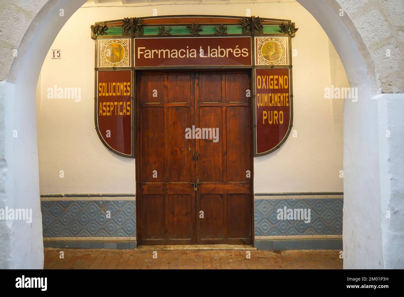 Vintage wooden entrance door of Spanish Pharmacy, Ciutadella de Menorca ...