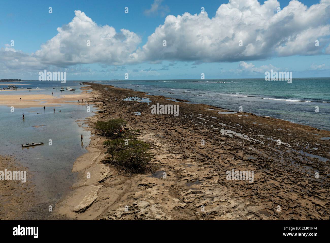 reefs between the beach and the sea at low tide Stock Photo - Alamy