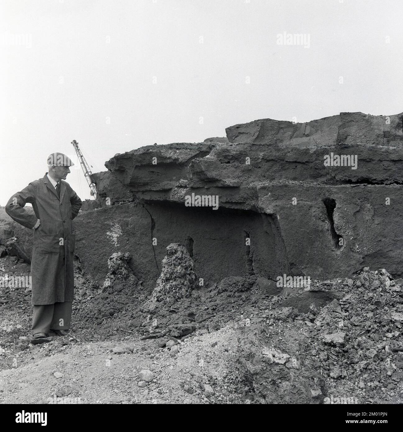 1950s, historical, on the construction site of a steelworks, a worker ...