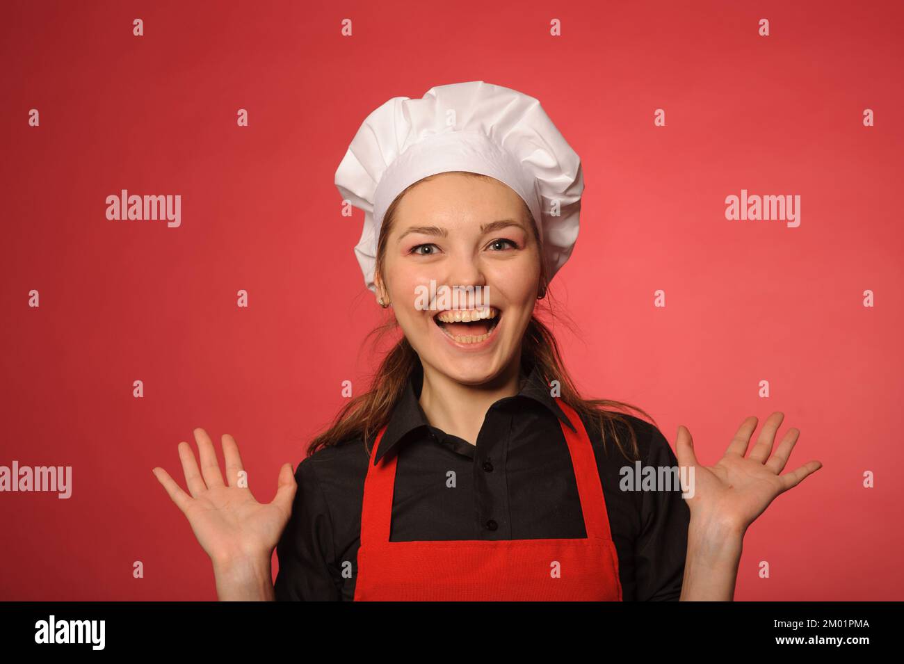 Young glad professional cook hi-res stock photography and images - Alamy