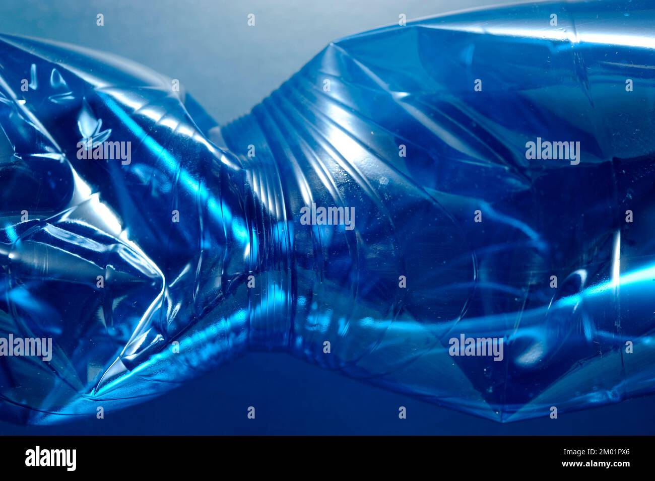 blue plastic bottle crumpled, abstract macro detail Stock Photo - Alamy