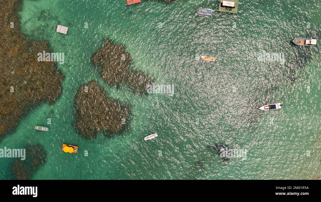 top view of small boats in natural pools formed by reefs Stock Photo ...