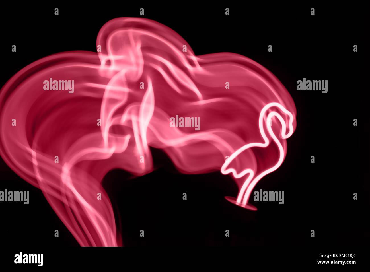 Neon viva magenta flamingo LED lamp with wave in motion as blurred ...