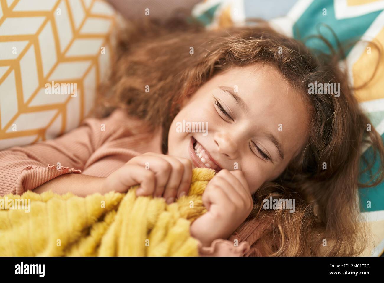 Adorable caucasian girl lying on sofa sleeping at home Stock Photo - Alamy