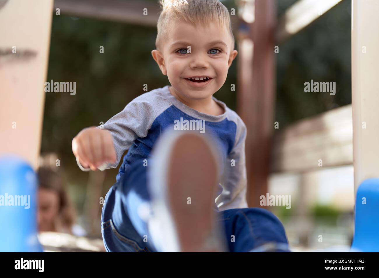 Adorable toddler smiling confident playing on slide at park playground Stock Photo - Alamy