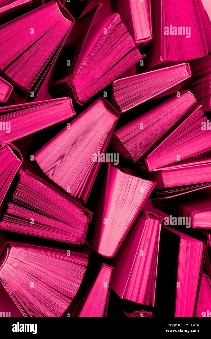 Book background in Viva Magenta colors. Red books top view. Color of ...