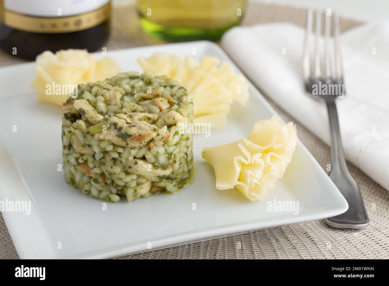 Chicken and pesto risotto with cheese Stock Photo - Alamy