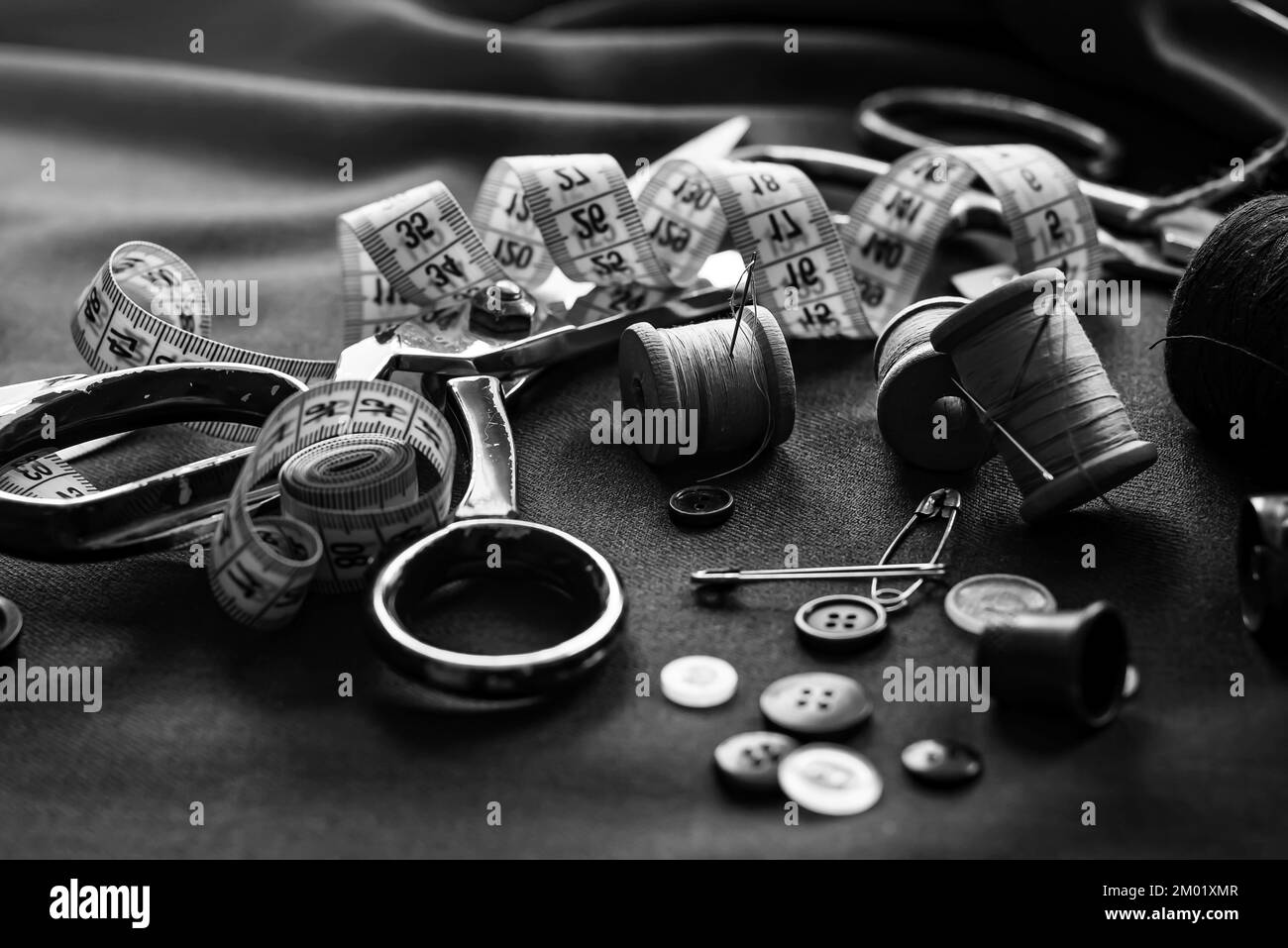 Retro tools for cutting and sewing. Needle with thread, thimble, sewing ...