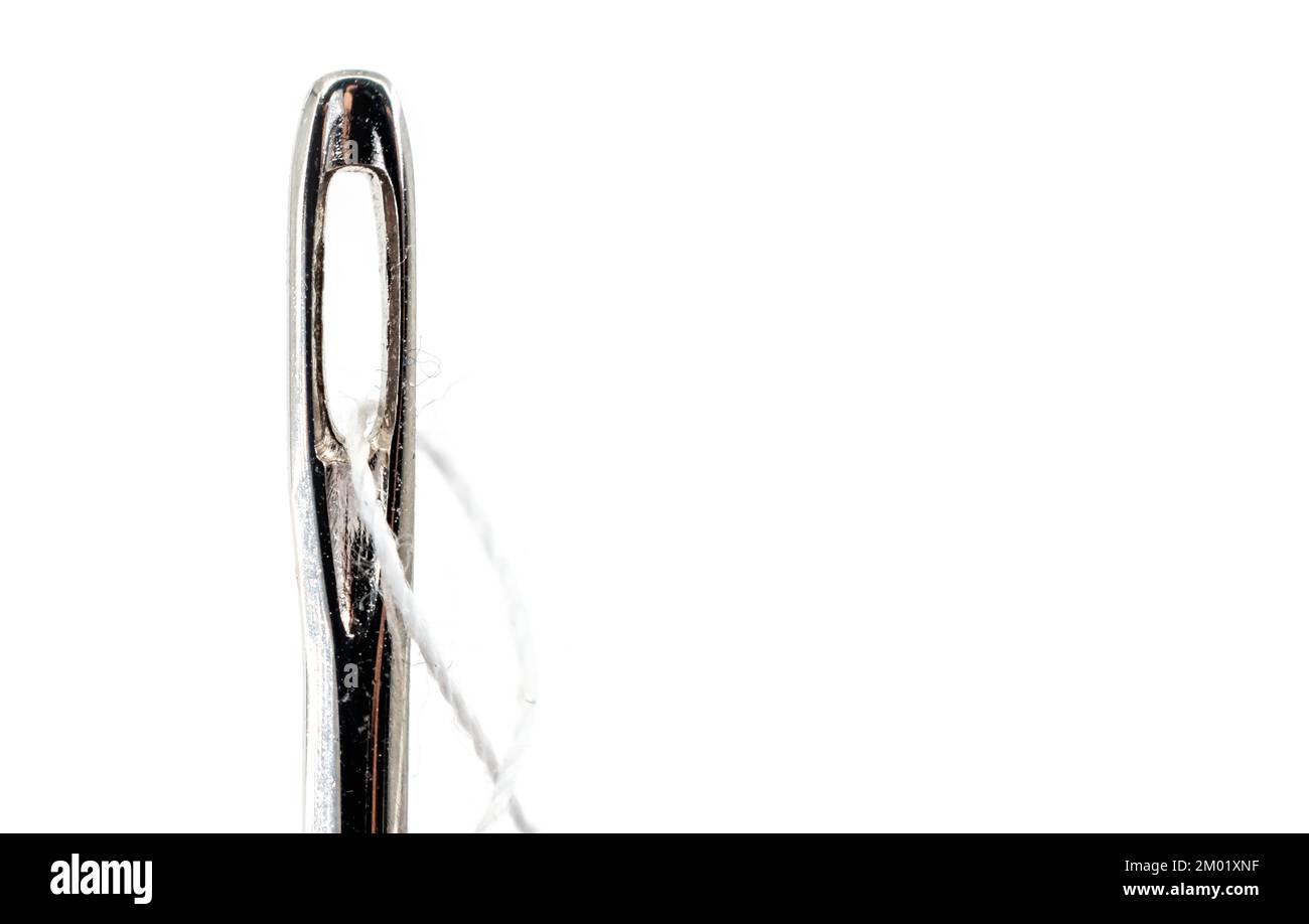 Needle and thread on a white background close-up. Needle isolate with ...