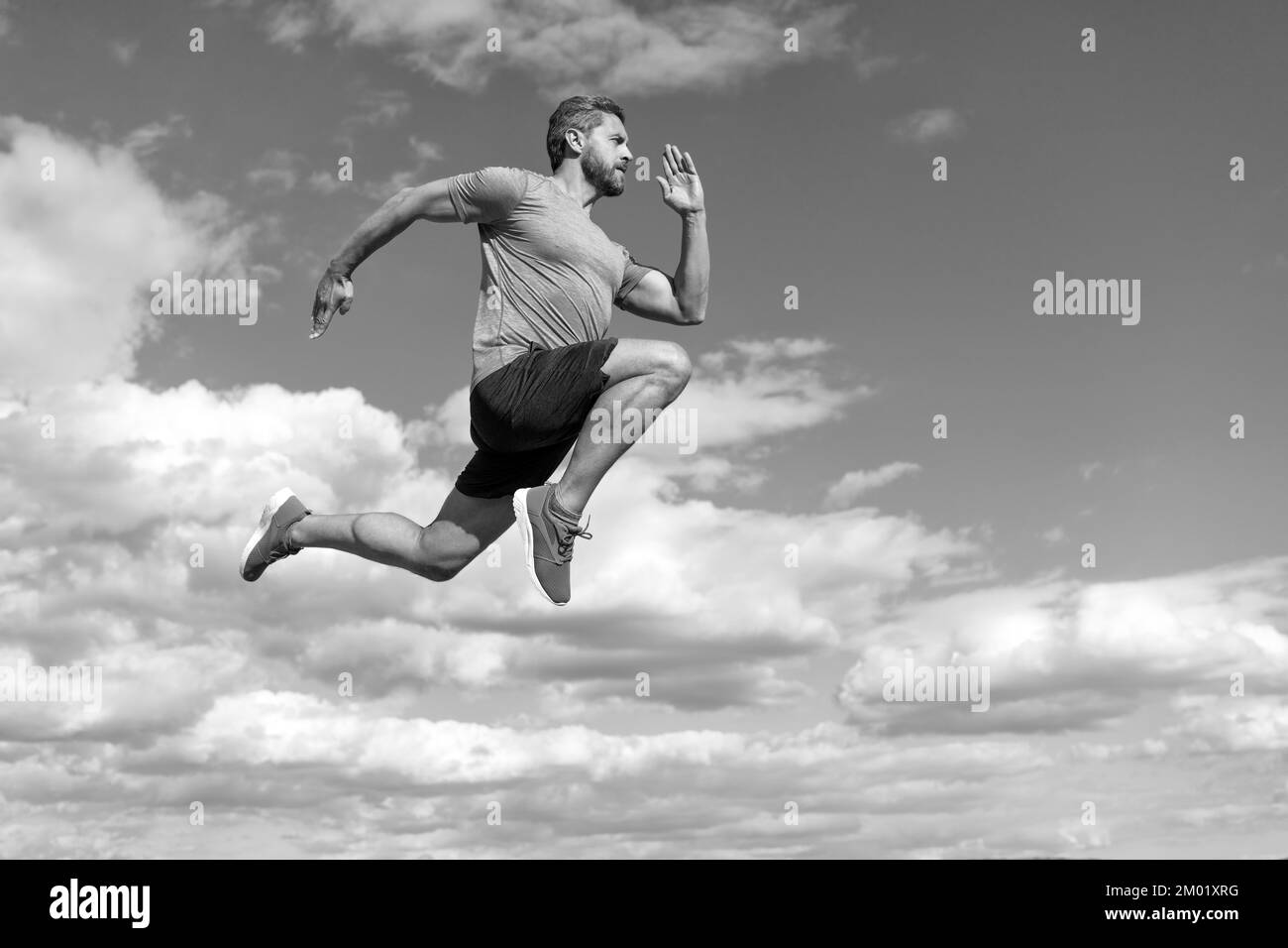 energetic man athlete with muscular body run in sportswear outdoor on ...