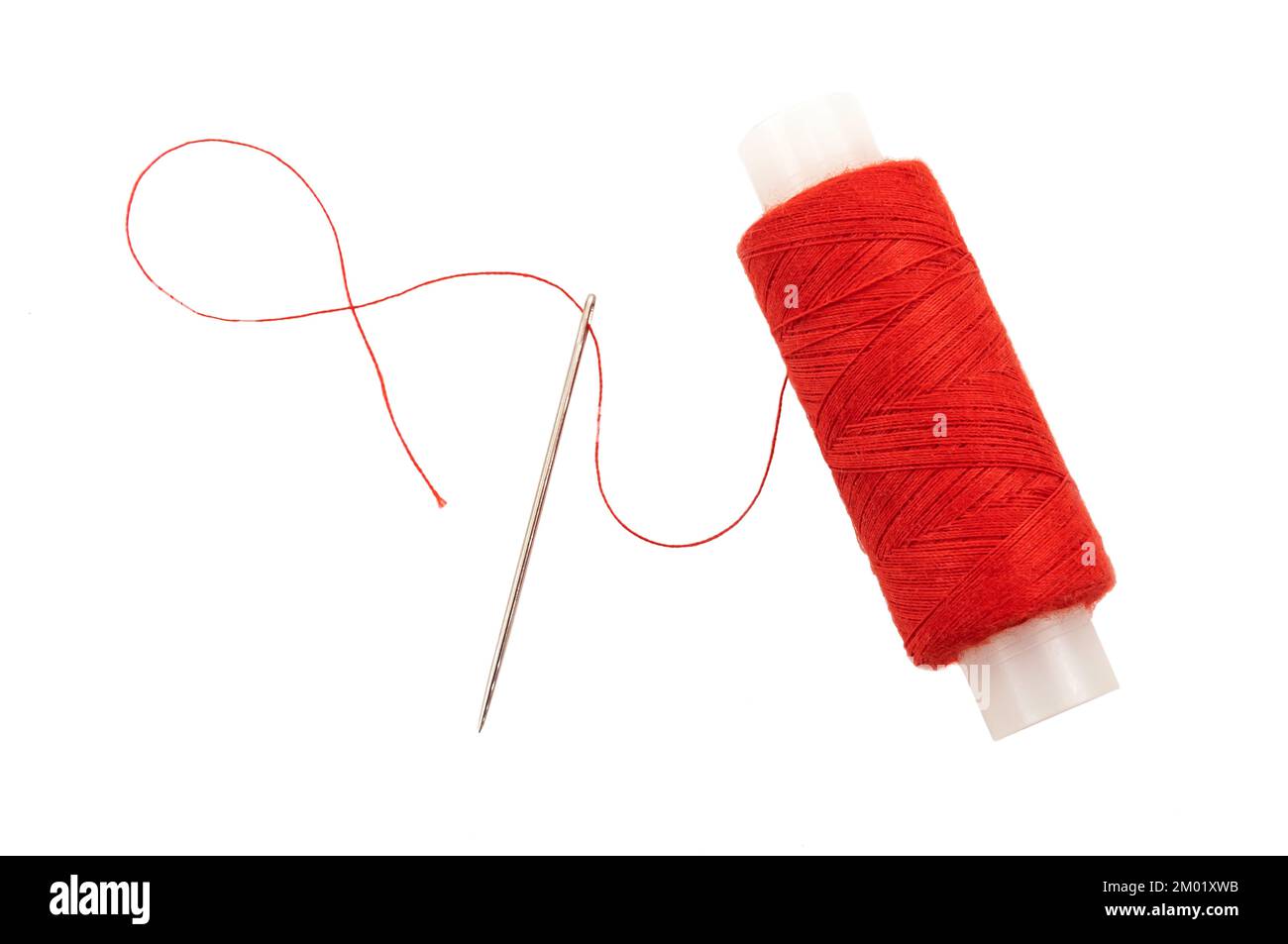 Needle with multi-colored threads on a white background. Eye of a ...