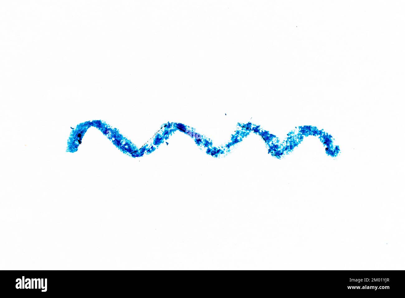 Blue color crayon hand drawing in zigzag line shape on white paper ...