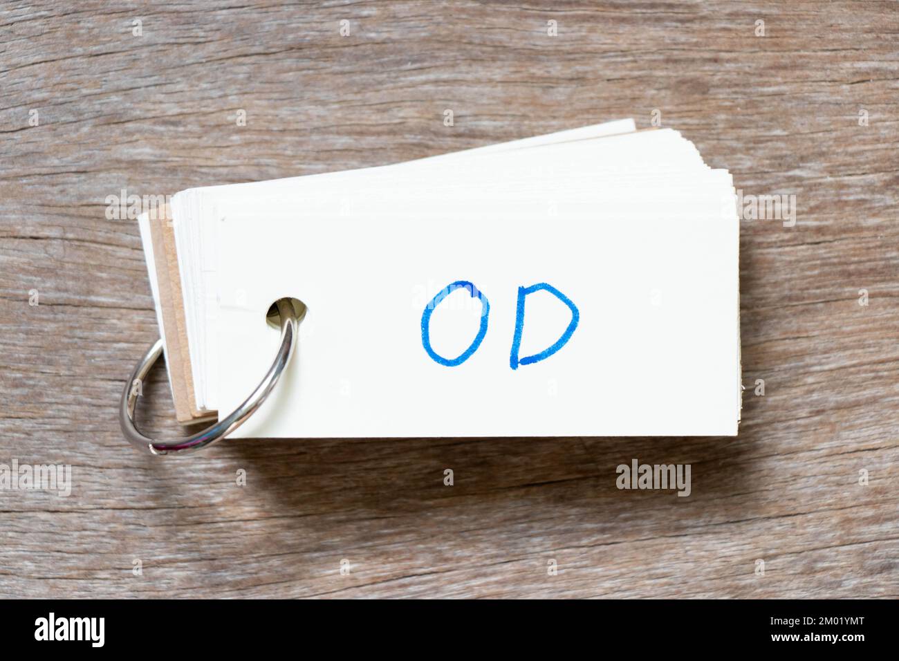 Flash card with handwriting in word OD (Abbreviation of overdraft) on ...