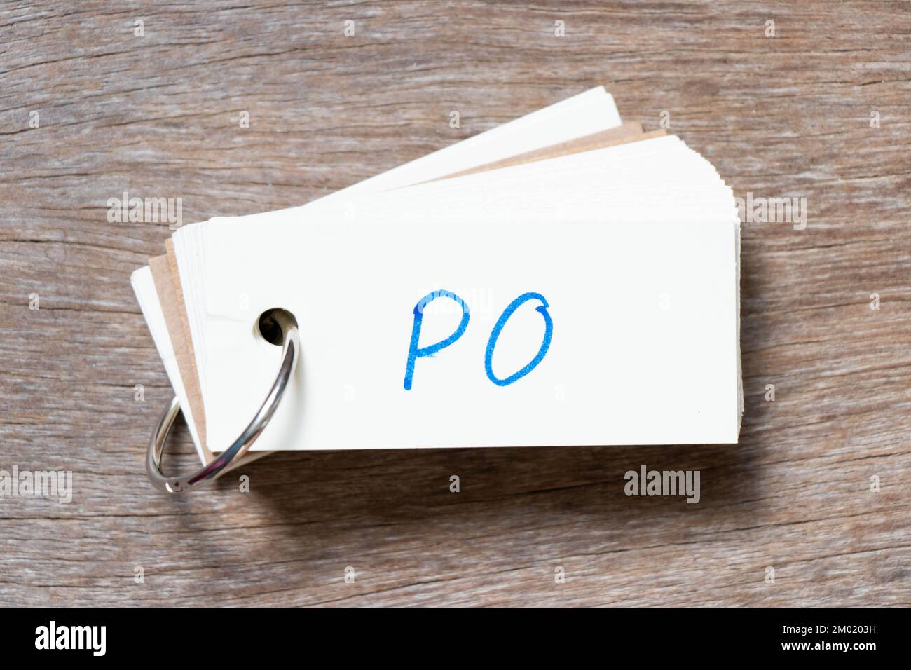 Flash card with handwriting in word PO (Abbreviation of purchase order ...