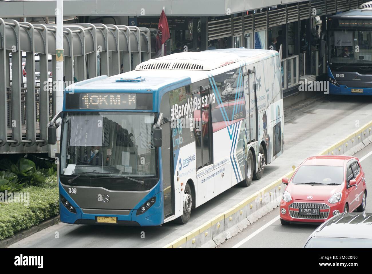 Trans Jakarta bus in bus way line, at the rush hour traffic. Location ...