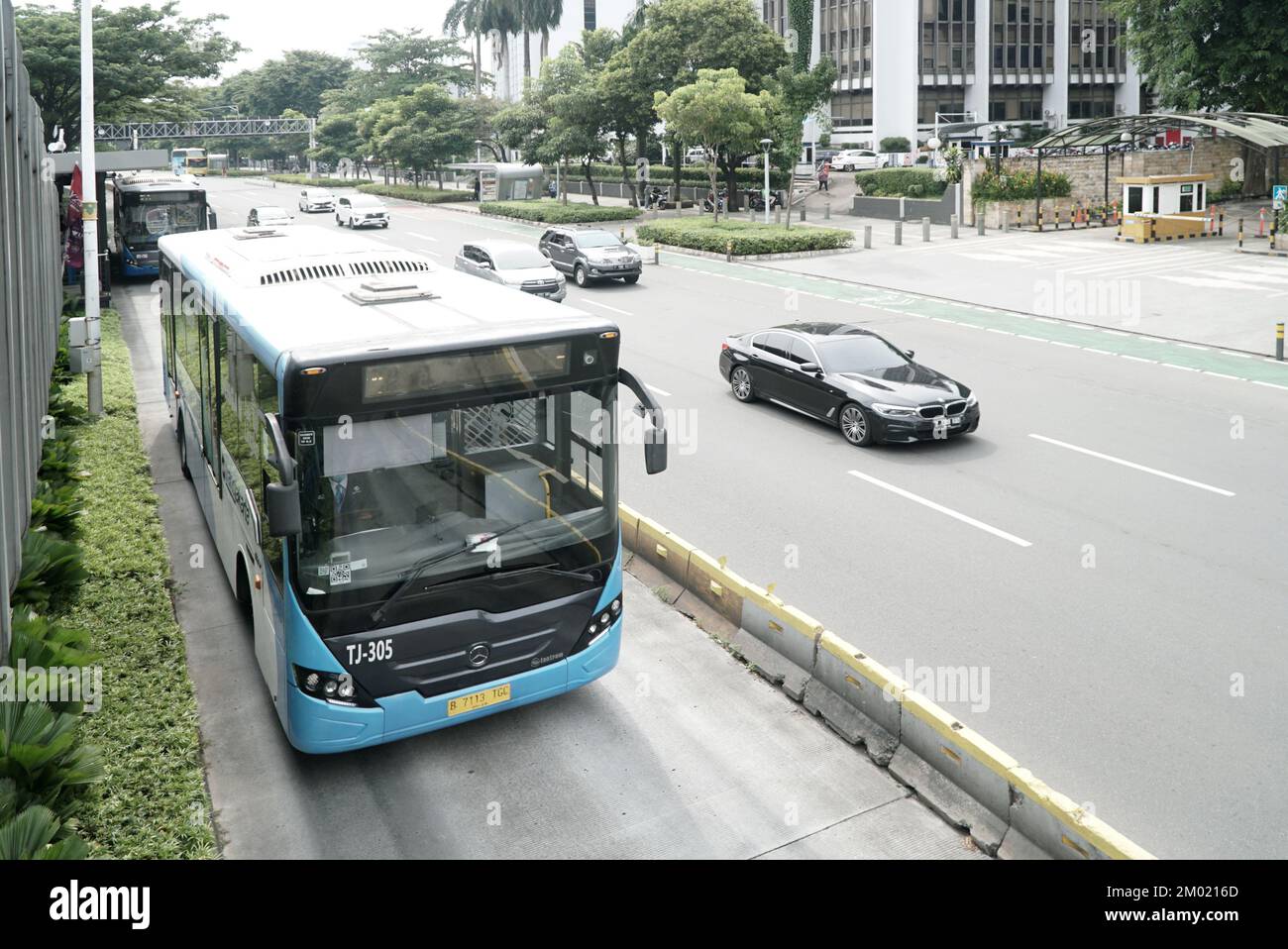 Trans Jakarta bus in bus way line, at the rush hour traffic. Location ...