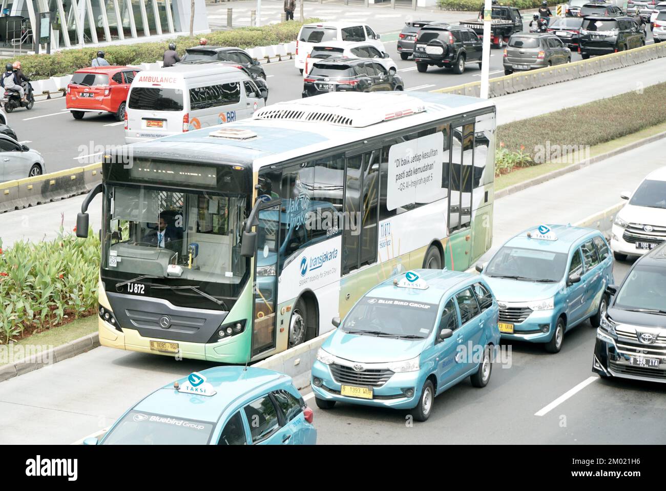 Trans Jakarta bus in bus way line, at the rush hour traffic. Location ...