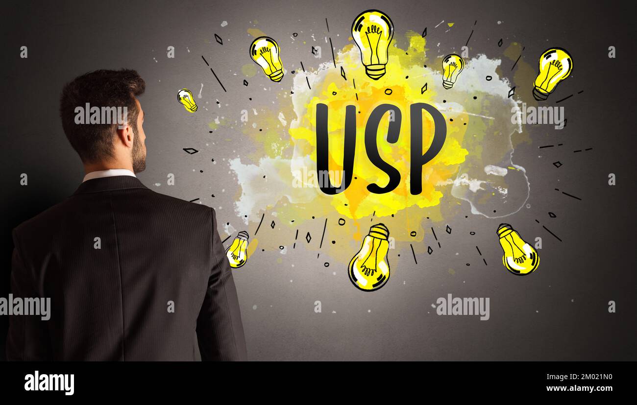 man drawing colorful light bulb Stock Photo - Alamy
