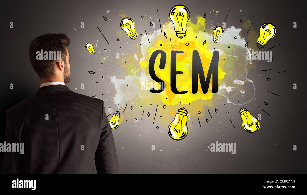 man drawing colorful light bulb Stock Photo - Alamy