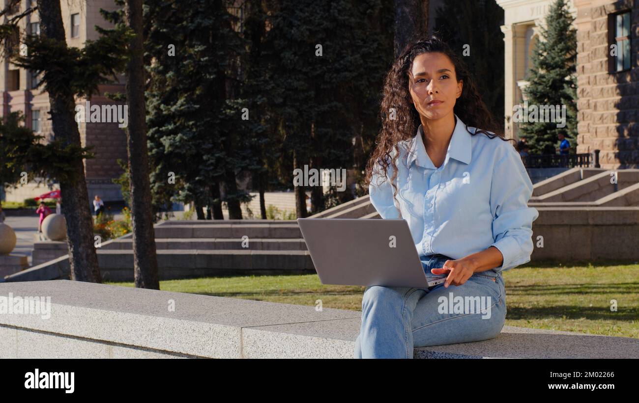 Business woman finishing work online studying with computer sitting in ...