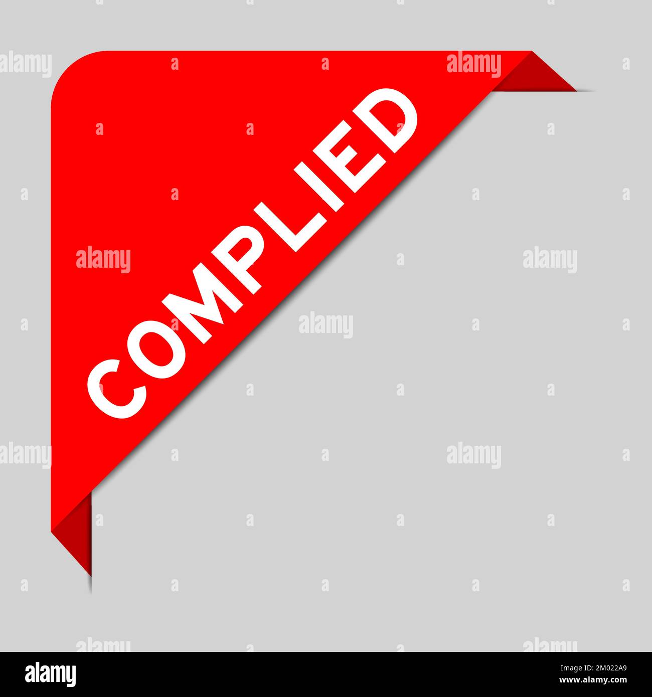 Red color of corner label banner with word complied on gray background ...