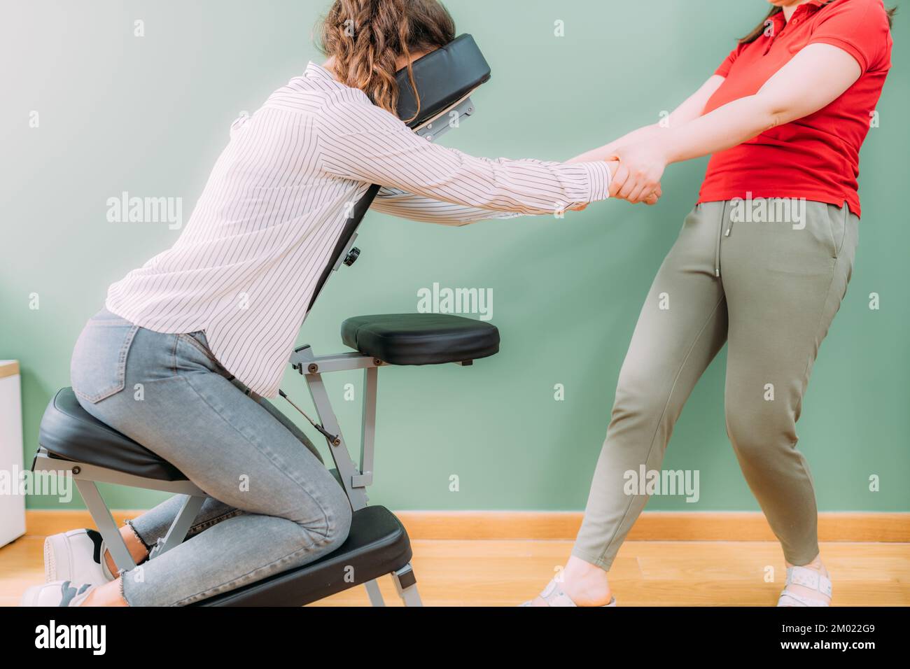 Chair massage in the office Stock Photo - Alamy